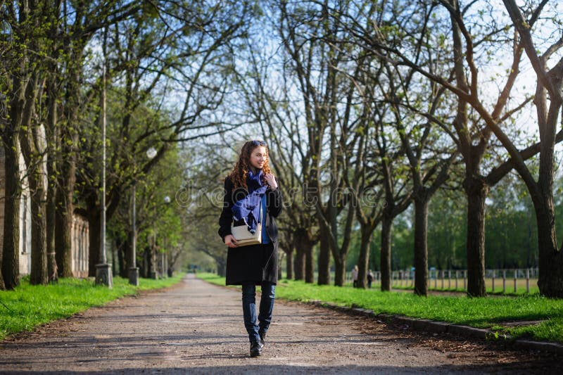 Beautiful Young Woman Walking on Spring Park Stock Photo - Image of ...