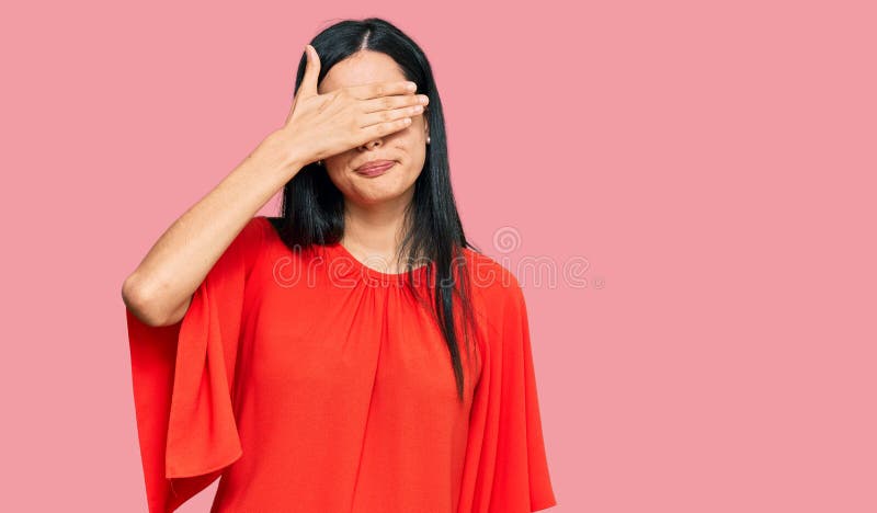 Beautiful Young Woman Wearing Casual Clothes Covering Eyes With Hand
