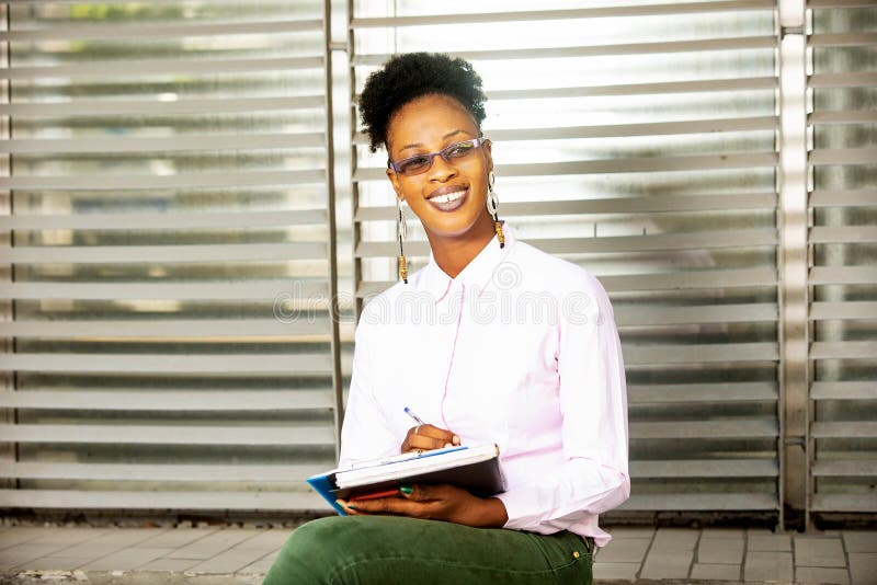Beautiful Young Woman Writing in a Document Stock Photo - Image of ...