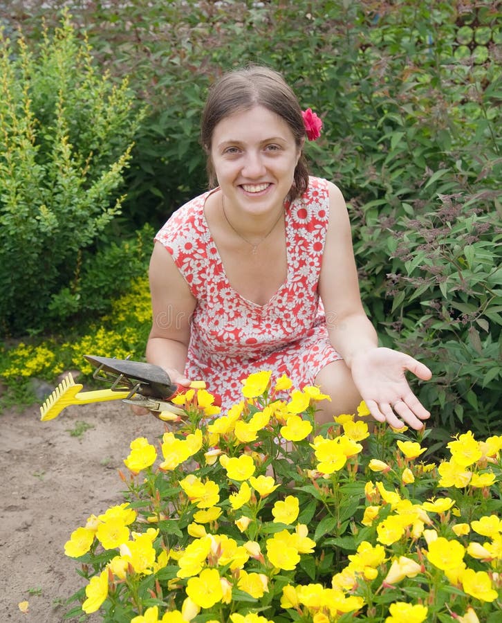 Beautiful Young Woman in the Yard Gardening Stock Image - Image of ...
