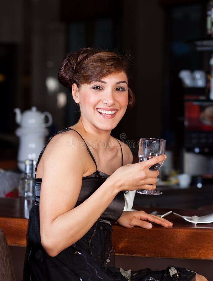 Beautiful Young Women Drinking Water at Bar Stock Photo - Image of ...