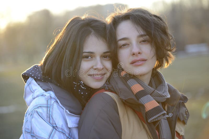 Beautiful Young Women Hugging Outside Stock Image - Image of beauty ...