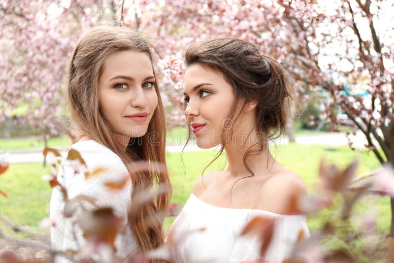 Beautiful Young Women in Park with Blooming Trees on Spring Day Stock ...