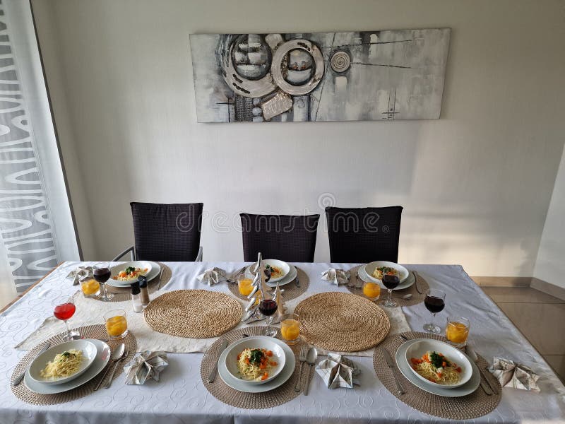 An Elegant Dining Setup Featuring Fine Cuisine Along with Modern Decor ...