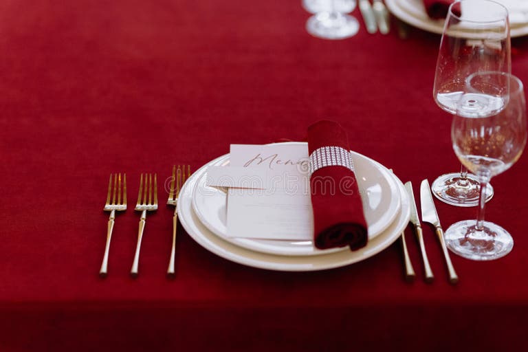 Elegant Table Setting with Silverware and Menu on Red Tablecloth Stock ...
