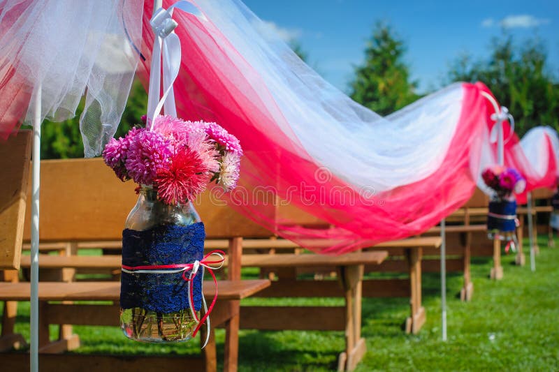 Beautifully Decorated Benches for Wedding Ceremony on the Lawn Stock ...