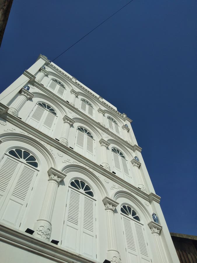 A Beautifully Desingned White Building and Bright Skies. Stock Image ...
