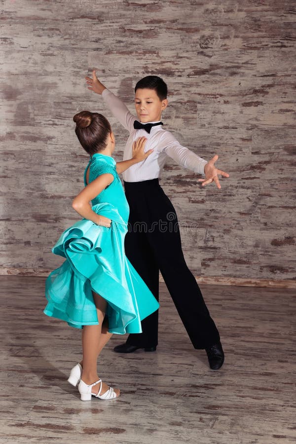 Beautifully Dressed Couple of Kids Dancing Together in Studio Stock ...