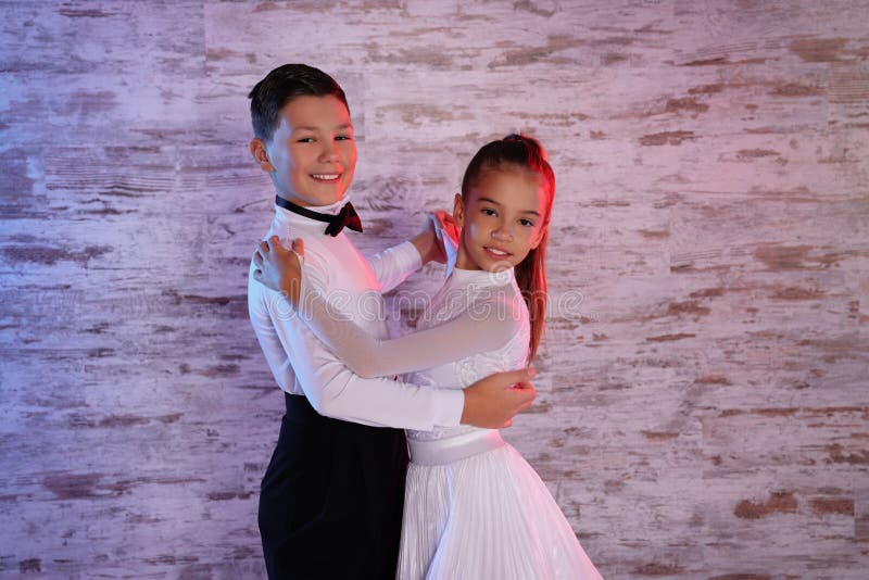 Beautifully Dressed Couple of Kids Dancing Together in Studio Stock ...
