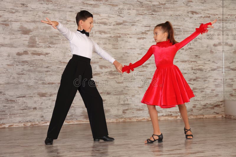 Beautifully Dressed Couple of Kids Dancing Together in Studio Stock ...