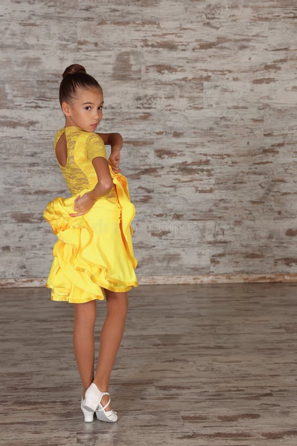 Beautifully Dressed Little Girl Dancing in Studio Stock Photo - Image ...
