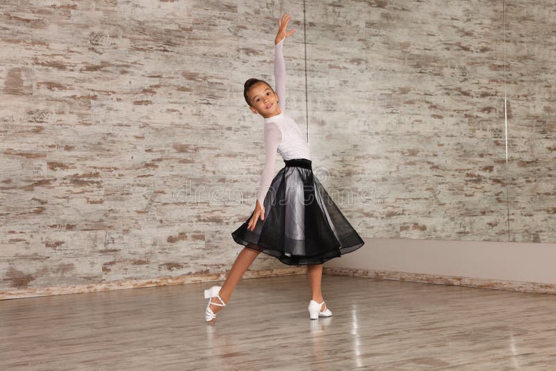 Beautifully Dressed Little Girl Dancing in Studio Stock Image - Image ...