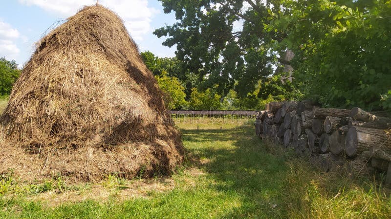 An Old Haystack Nestled Against a Sturdy Stone Wall in a Beautiful ...