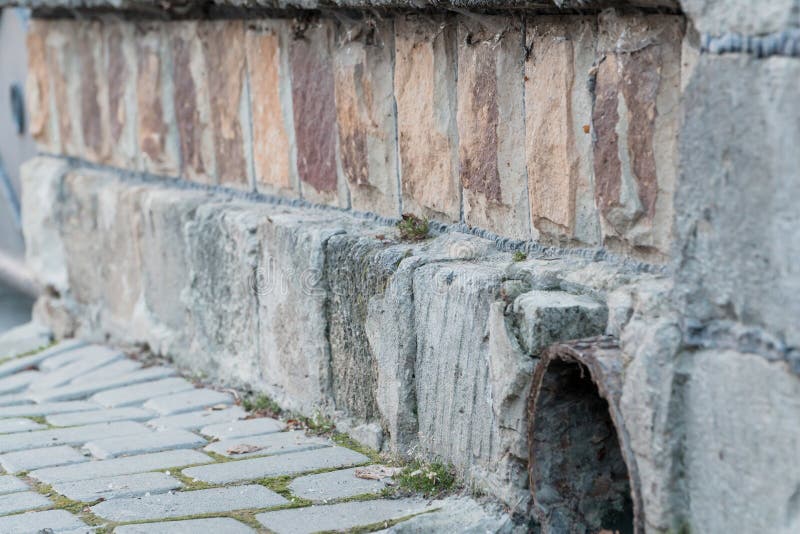 Beautifully Textured Stone Wall with Curb and Drainage System Stock ...