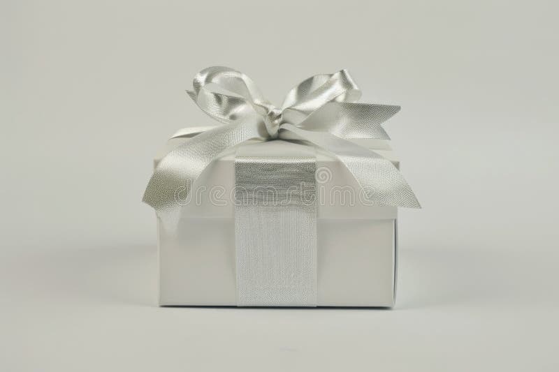 A Beautifully Wrapped Gift Box with a Shiny Silver Bow Stock Photo ...