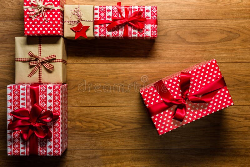 Beautifully Wrapped Christmas Gift on a Plain Red Background Stock ...