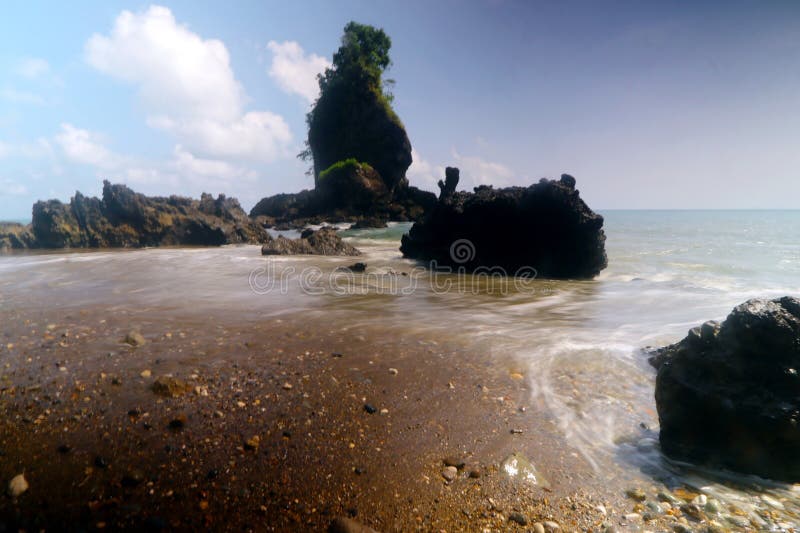 The Beauty of the Beach with Cliffs, Waves and Trees on Karang Agung ...