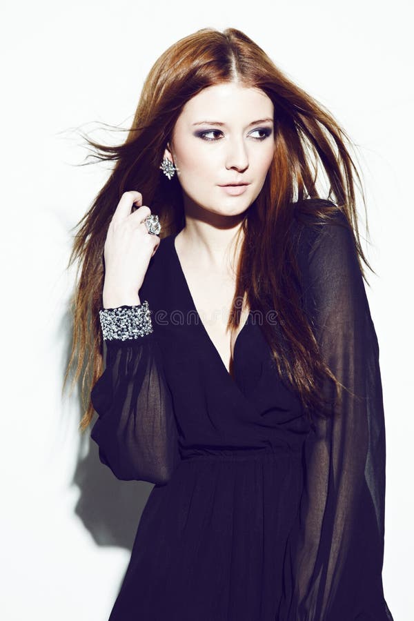 Beauty in a Black Dress. Studio Shot of a Beautiful Young Model Posing ...