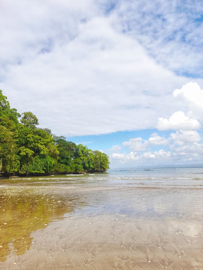 The Beauty of a Calming Beach Atmosphere with Calm Waves and White ...
