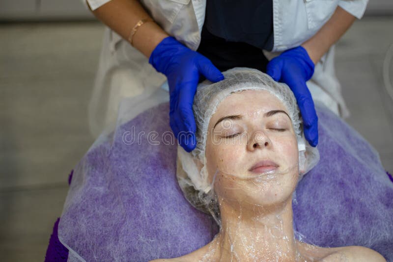 Beauty Clinic Woman Gets A Professional Facial Procedure Beautician