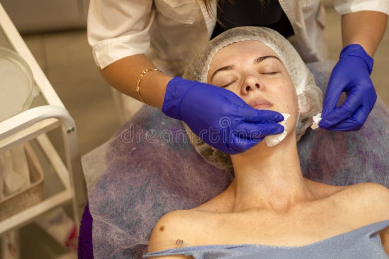 Beauty Clinic Woman Gets A Professional Facial Procedure Beautician