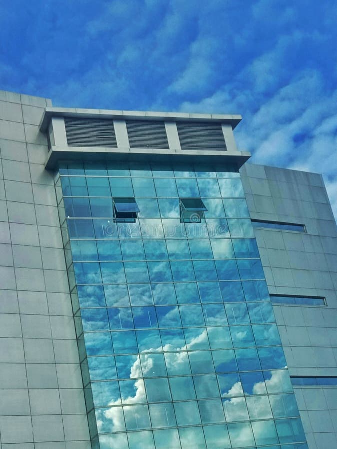 Cloudy building stock image. Image of clouds, front - 201248447