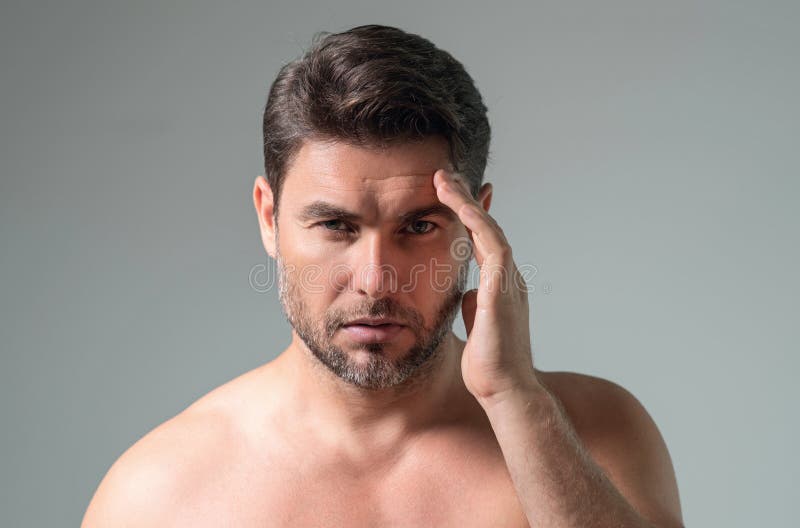 Beauty Face Portrait Of A Beautiful Man Applying Face Cream Skincare