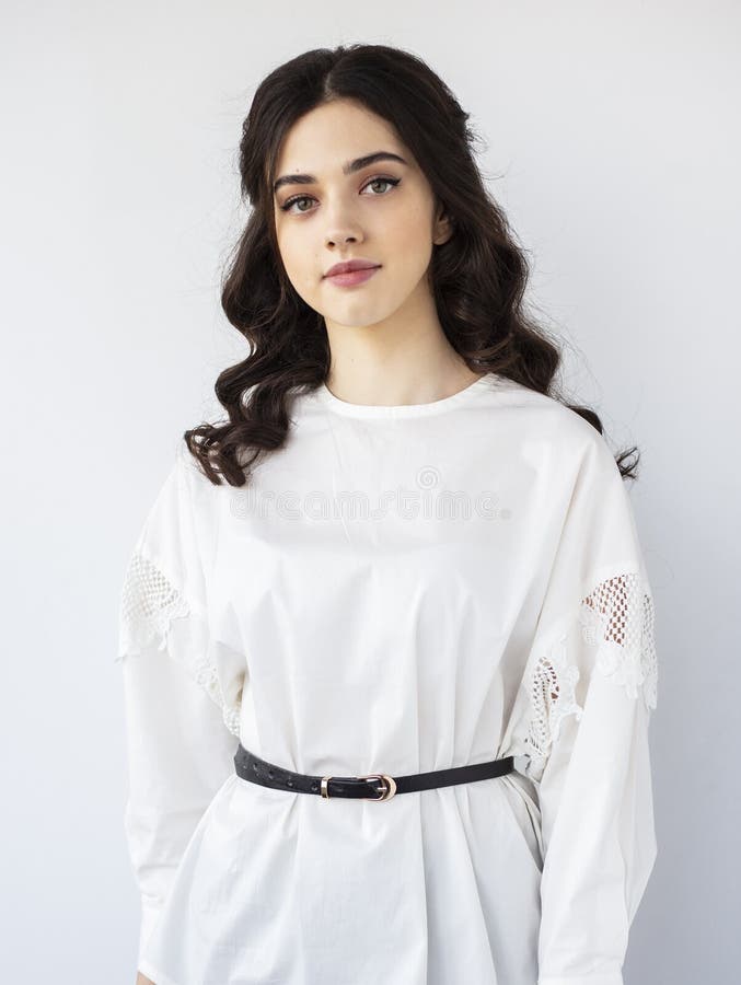 Beauty Front Portrait Of A Smiling Young Woman Wear White Shirt Posing