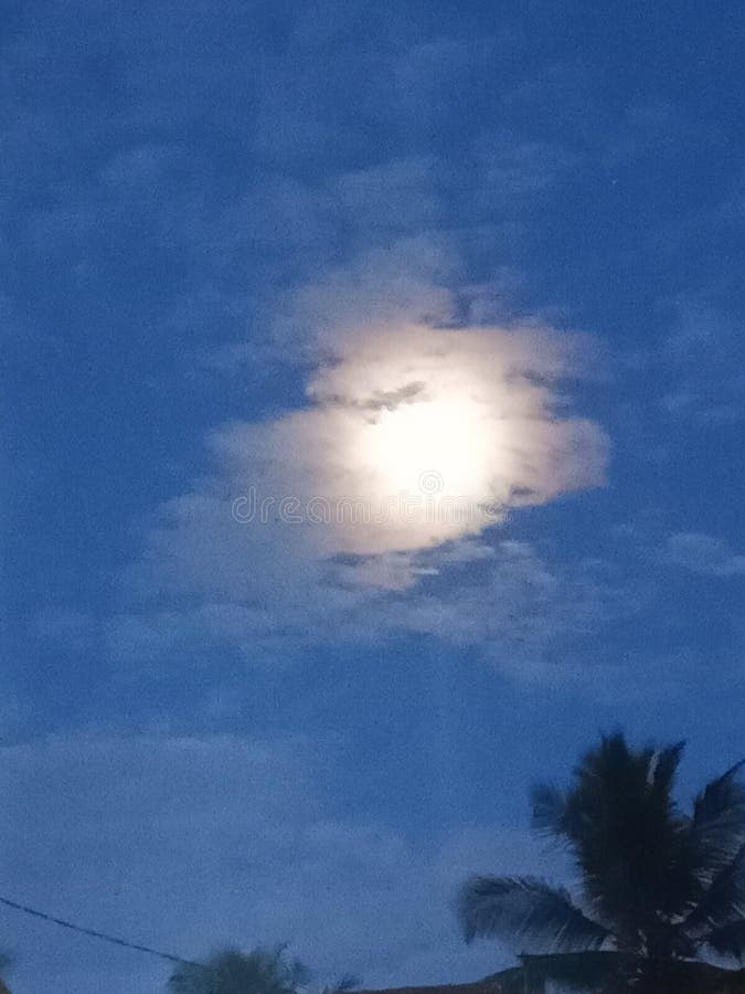 The Beauty of the Full Moon Covered by White Clouds Stock Photo - Image ...