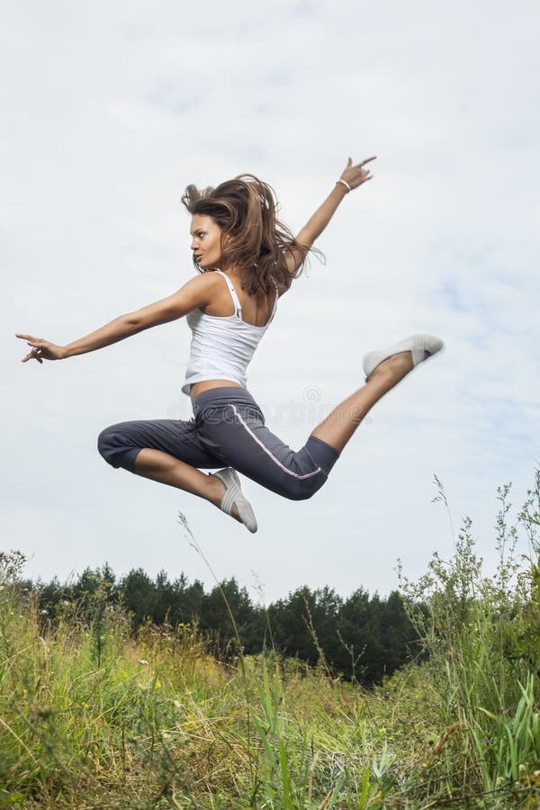 Beauty girl jumping stock photo. Image of nature, casual - 67800898