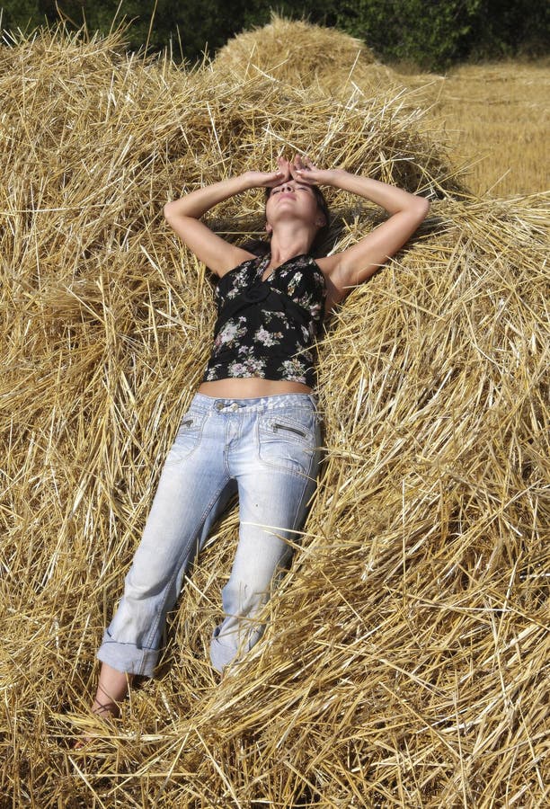 Beauty on a haystack. stock photo. Image of erotic, female - 88584630