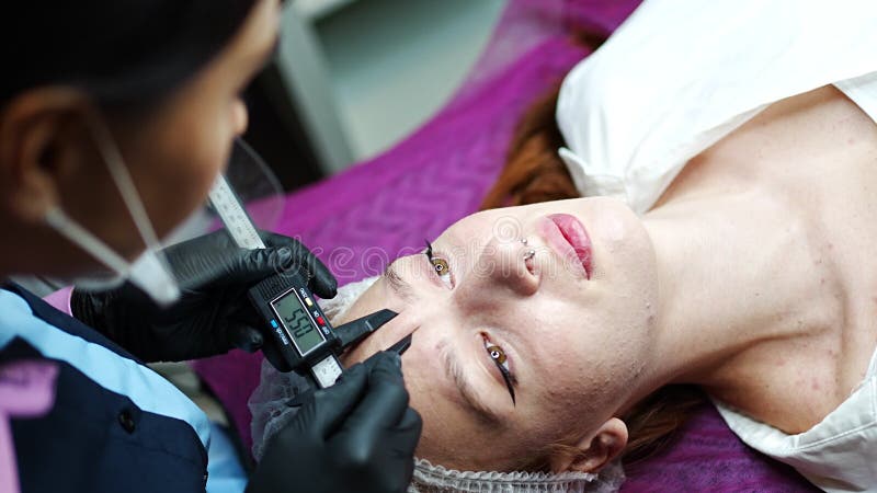 Beautician Measuring Eyebrows with Digital Caliper Tool on Woman S Face ...
