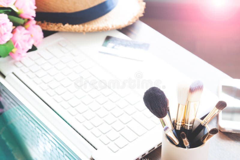 Beauty and Online Shopping Concept with Make-up Brushes and Laptop ...