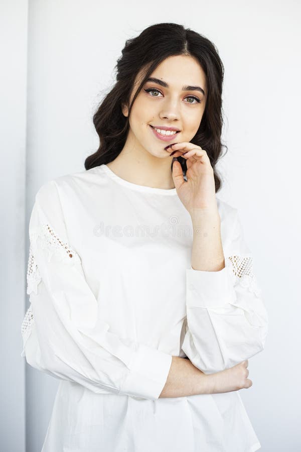 Beauty Front Portrait Of A Smiling Young Woman Wear White Shirt Posing