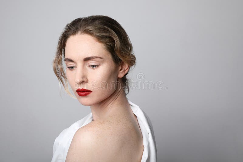 Beauty Portrait Of Young Woman With Red Lips Wearing White Clothing