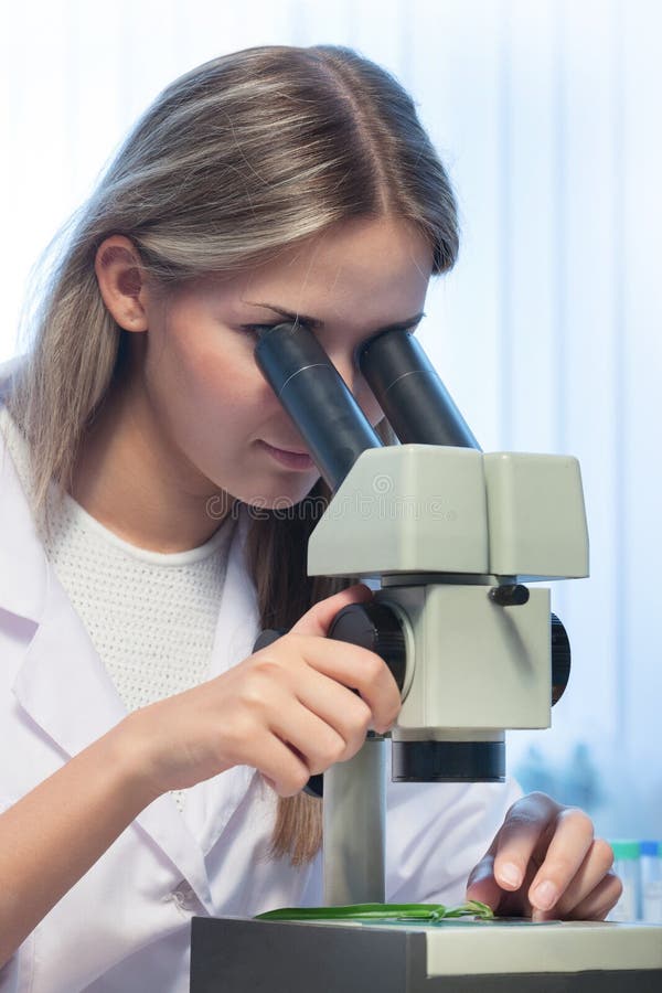Scientist with microscope stock photo. Image of genetic - 16662984