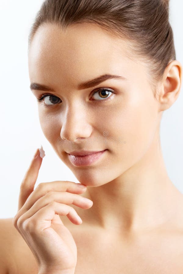 Beauty Skin Care Beautiful Happy Woman Applying Cosmetic Cream On