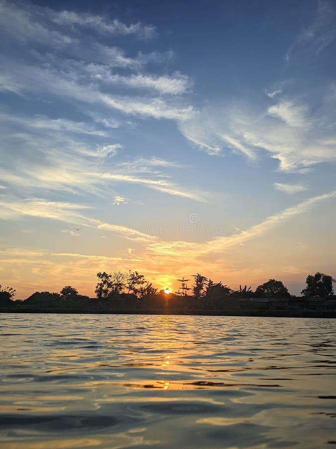 The Beauty of the Sunset by the River that Soothes the Heart Stock ...