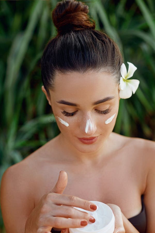 Beauty Woman Concept Skin Care Portrait Of Female Model Holding And