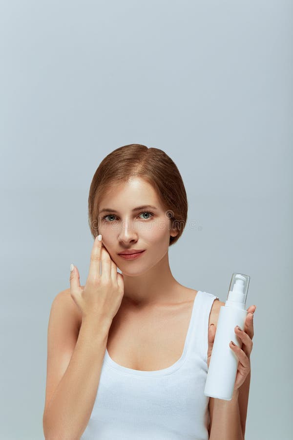 Beauty Woman Facial Care Female Applying Cream And Smiling Beauty