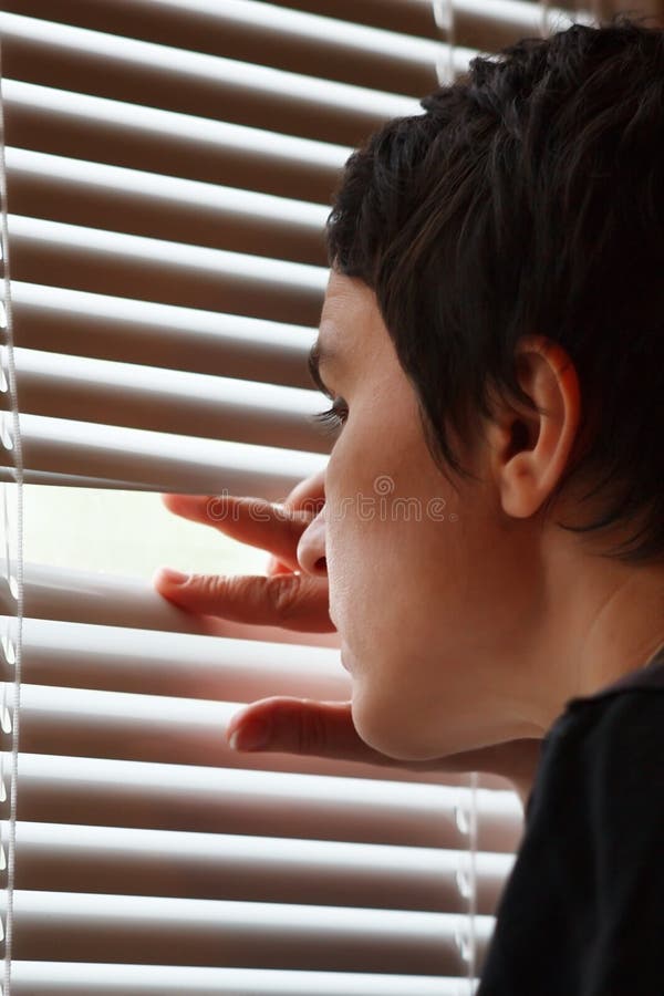 Beauty Woman Looking through the Blinds of a Dark Room Stock Image ...