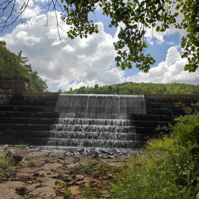 The Beaver River Dam Waterfall Beautiful Blue Sky with Clouds Trees ...