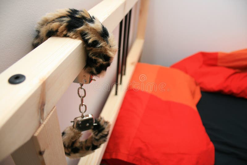 A Bed with Attached Handcuffs Stock Image - Image of cuffs, fetish: 6027169