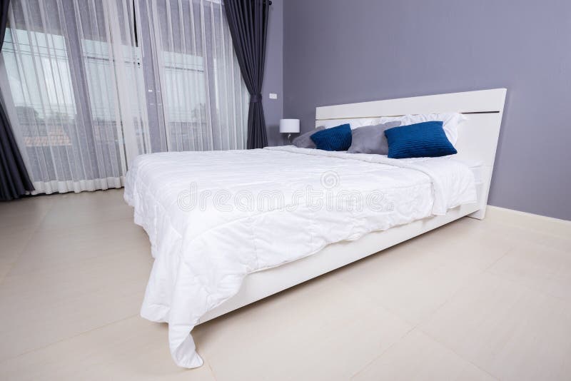Bed in bedroom in home stock image. Image of interior - 109970235
