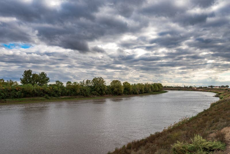 The Bed of a Calm Plain River Stock Photo - Image of overcast, green ...