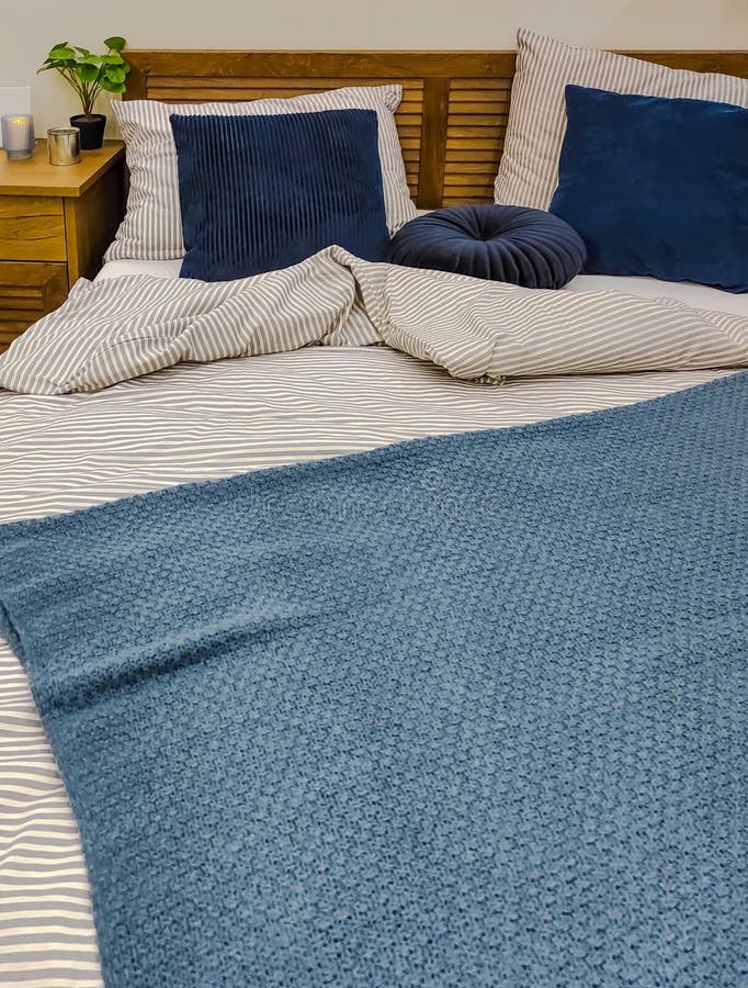 Bed with Cozy Bedding with Blue Color Elements Stock Image - Image of ...