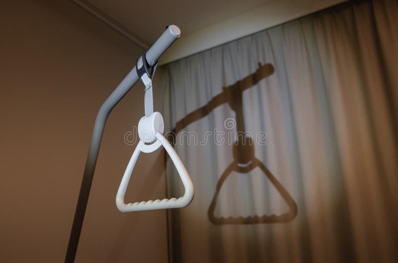 Bed with Hospital Pull-up Device. Brown Curtains Stock Image - Image of ...