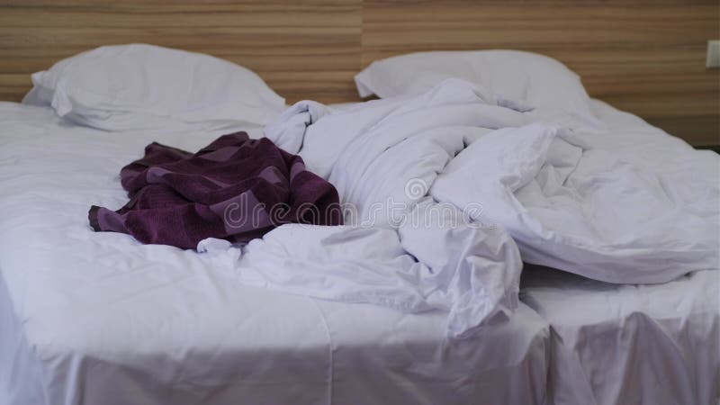 Bed with Pillows and Crumpled Blanket. Crumpled Blanket and Pillows on ...