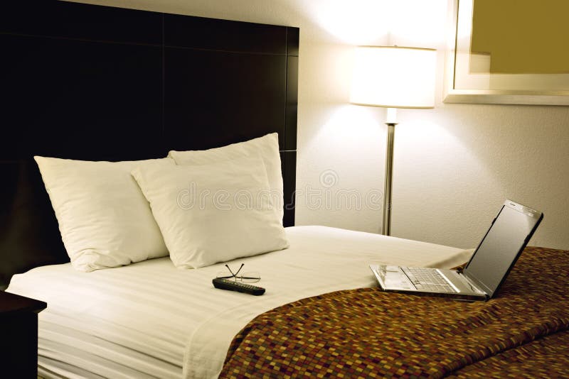 Bed with Remote Control and Computer Stock Image - Image of room ...