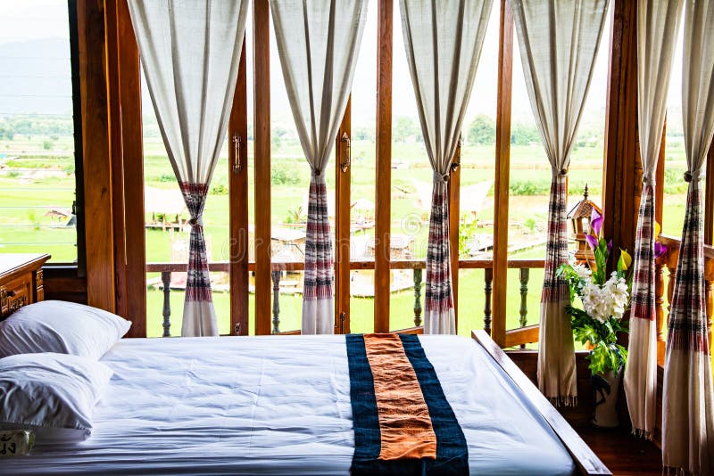 Bed room beside rice field stock photo. Image of indoors - 129971786